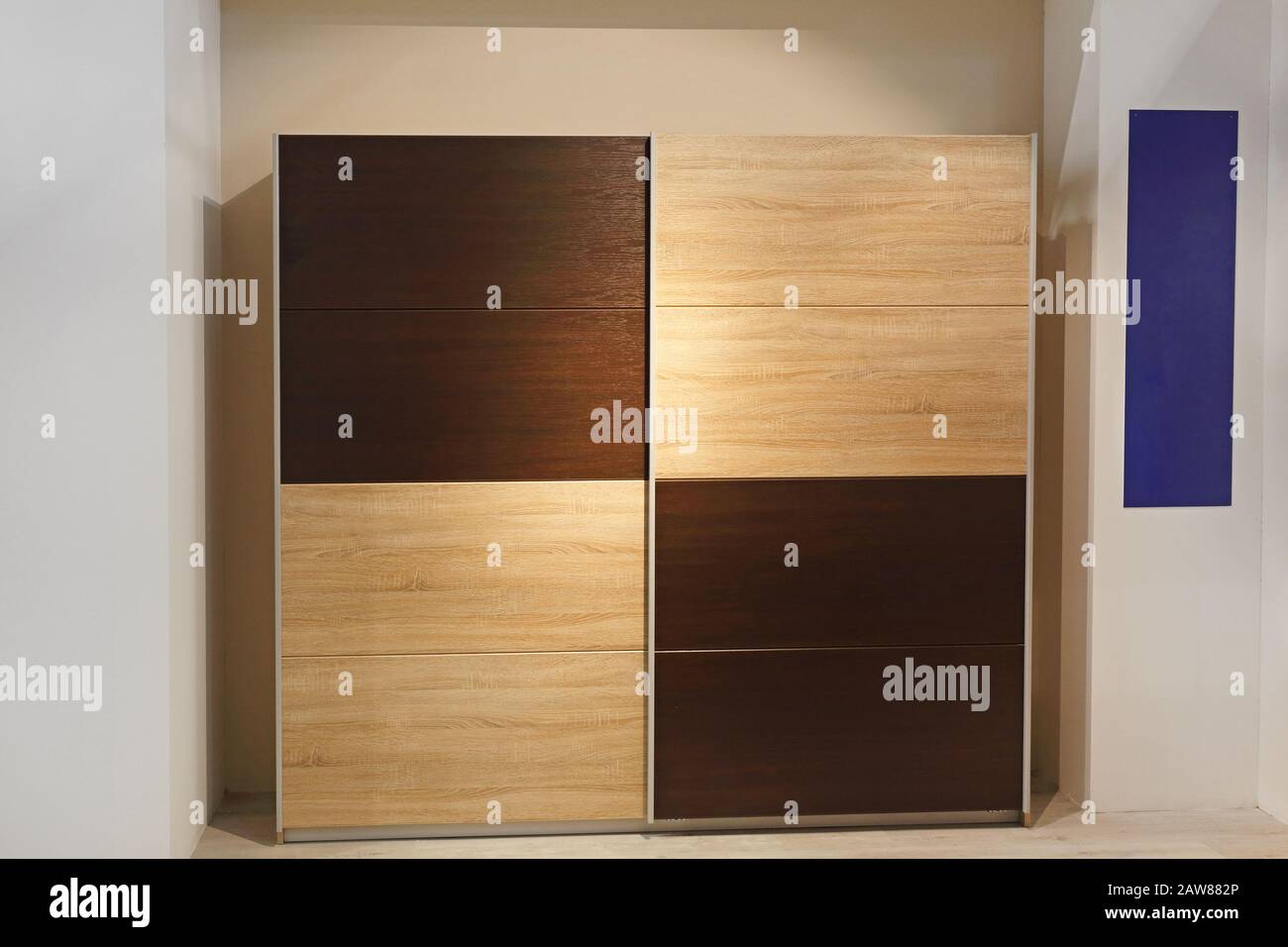 Square Wooden Doors Wardrobe Closet in Bedroom Stock Photo - Alamy