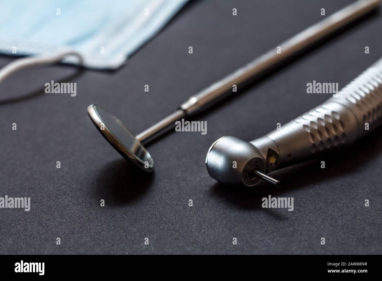 Set of metal dental instruments for dental treatment. High-speed dental ...