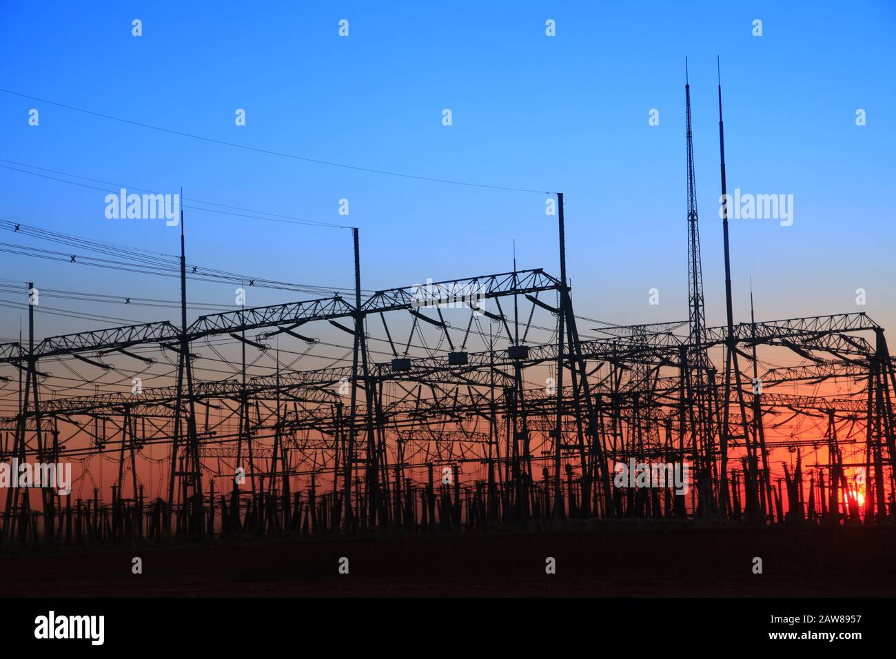 The power supply facilities of contour in the evening Stock Photo - Alamy