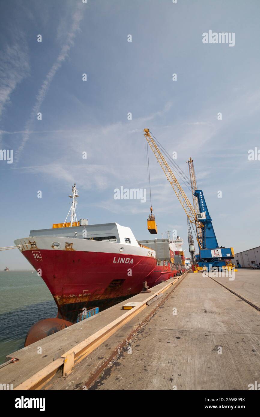 Dock crane loading and unloading a container from a container ship ...