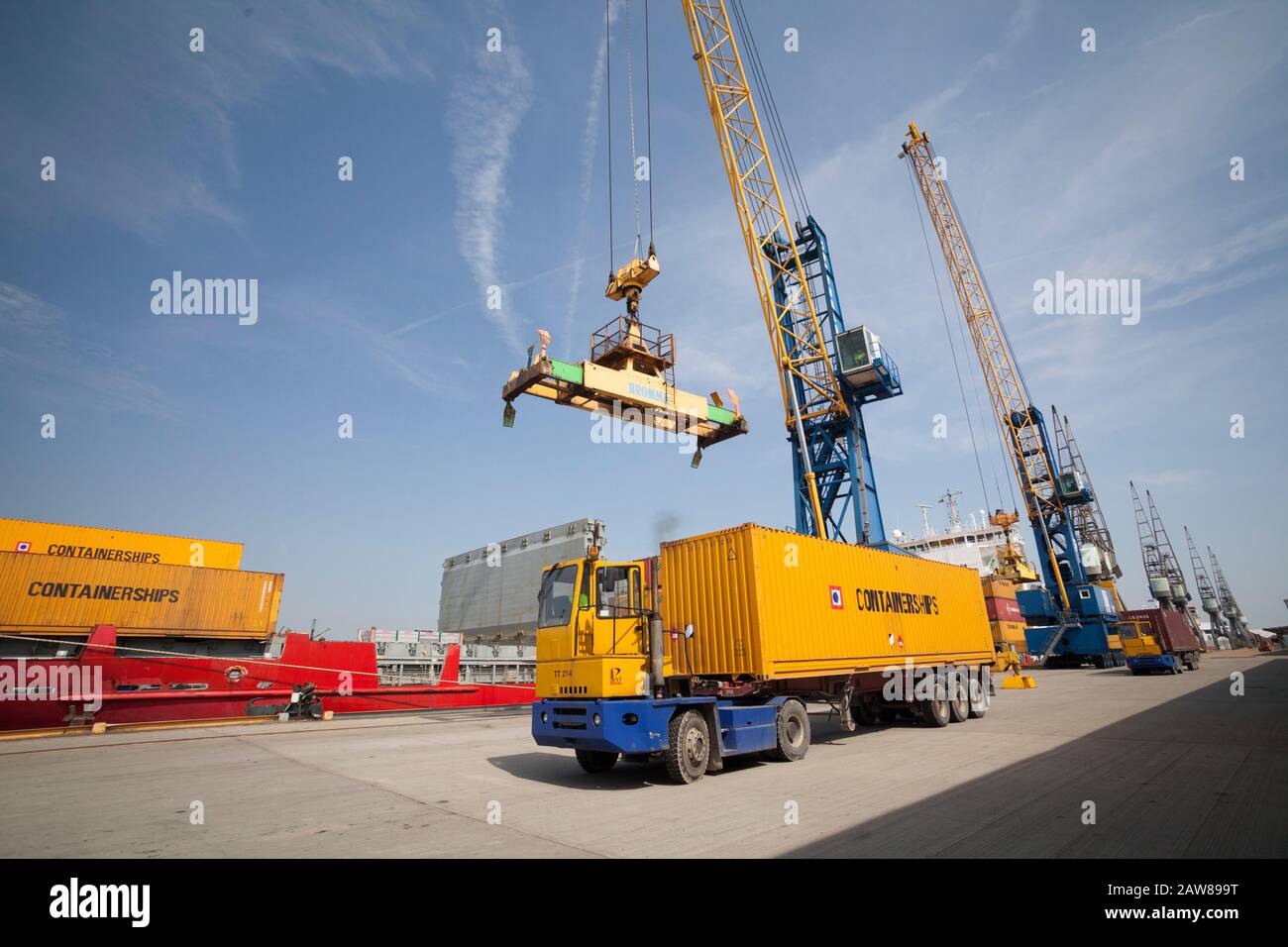 Dock crane loading and unloading a container from a container ship ...