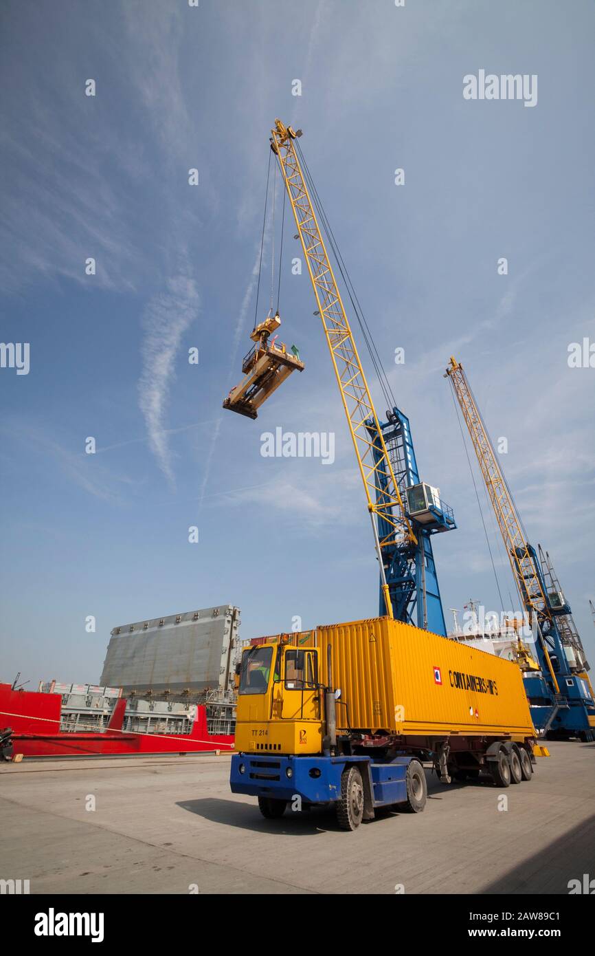 Dock crane loading and unloading a container from a container ship ...