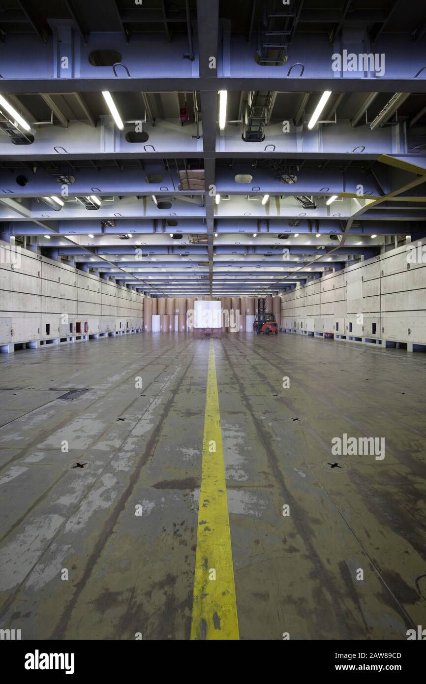 Interior of cargo ship hold transporting paper Stock Photo - Alamy