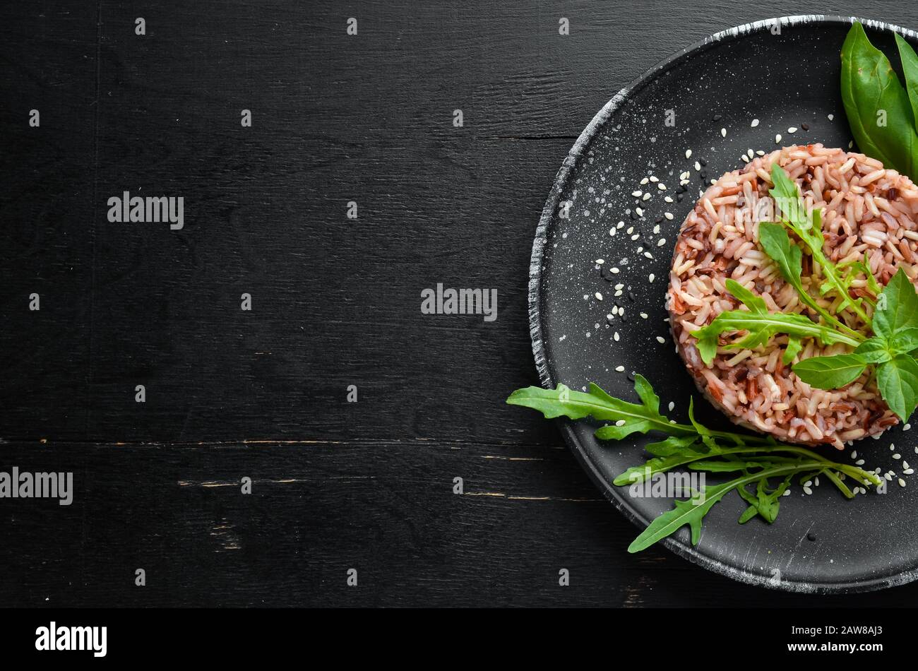 Boiled wild rice with arugula. Dishes menu. Free copy space. Top view ...