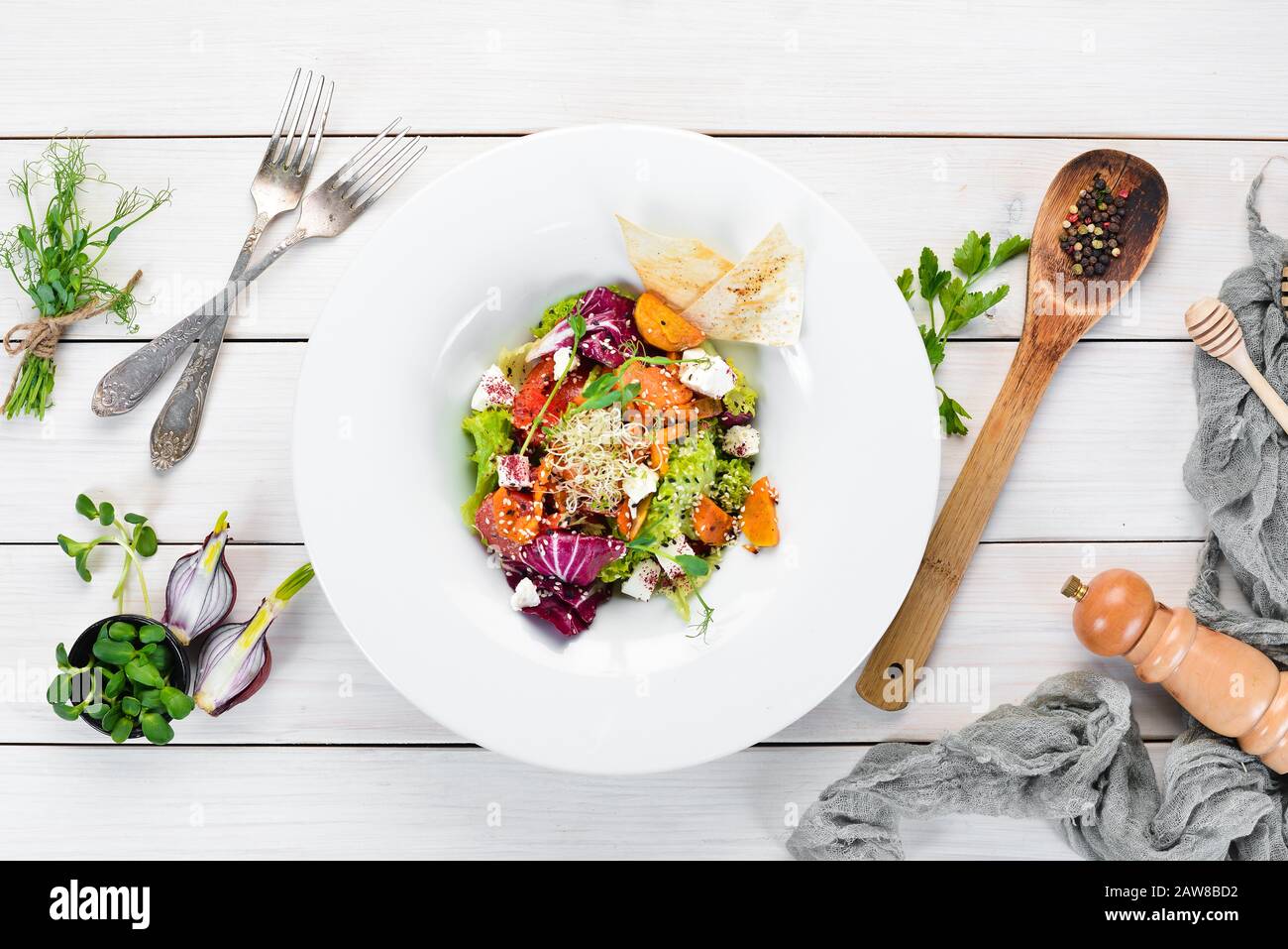 Vegetable salad with cabbage with feta cheese. In the plate. Top view ...