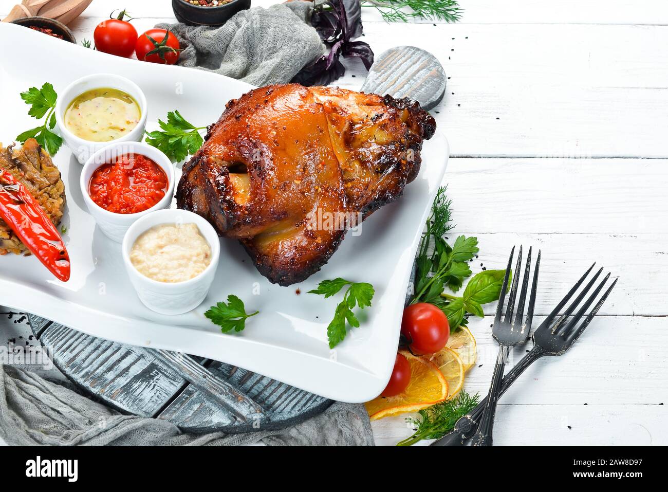 Baked pork leg with sauces. Dishes, food. Top view. Free space for your ...