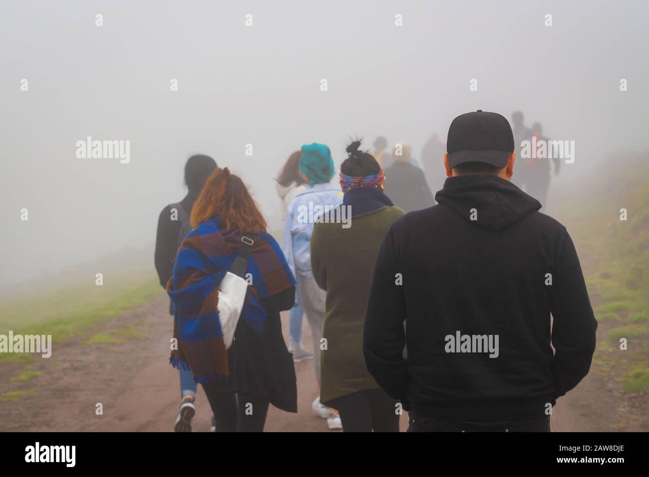 Back view of refugees walk to the border in a cold day under fog Stock ...