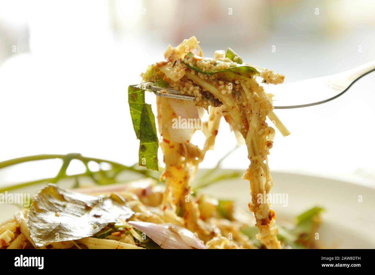 spicy slice bamboo shoot salad in Thai northeastern style scooping on ...