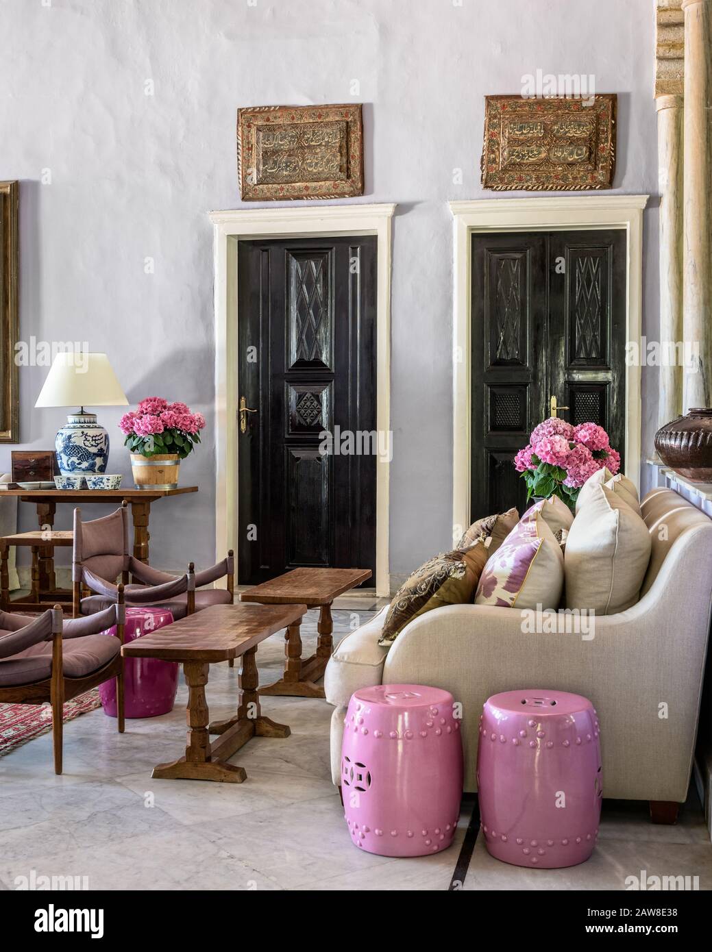 Sofa and tables in feminine living room Stock Photo - Alamy