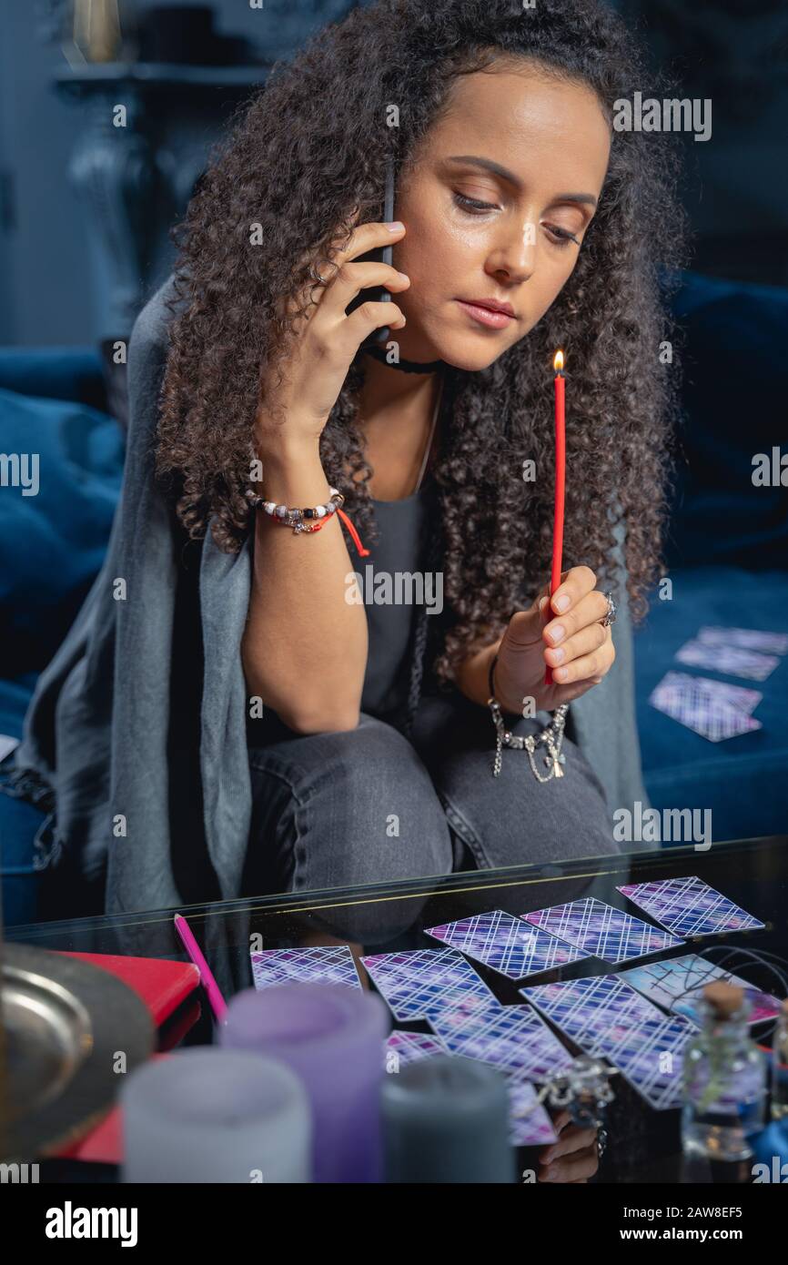 Serious young woman making a phone call Stock Photo - Alamy