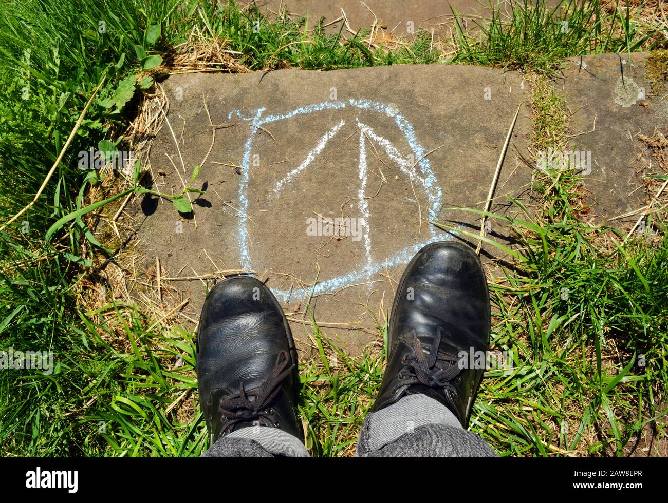 Person standing Information sign written with chalk Stock Photo - Alamy