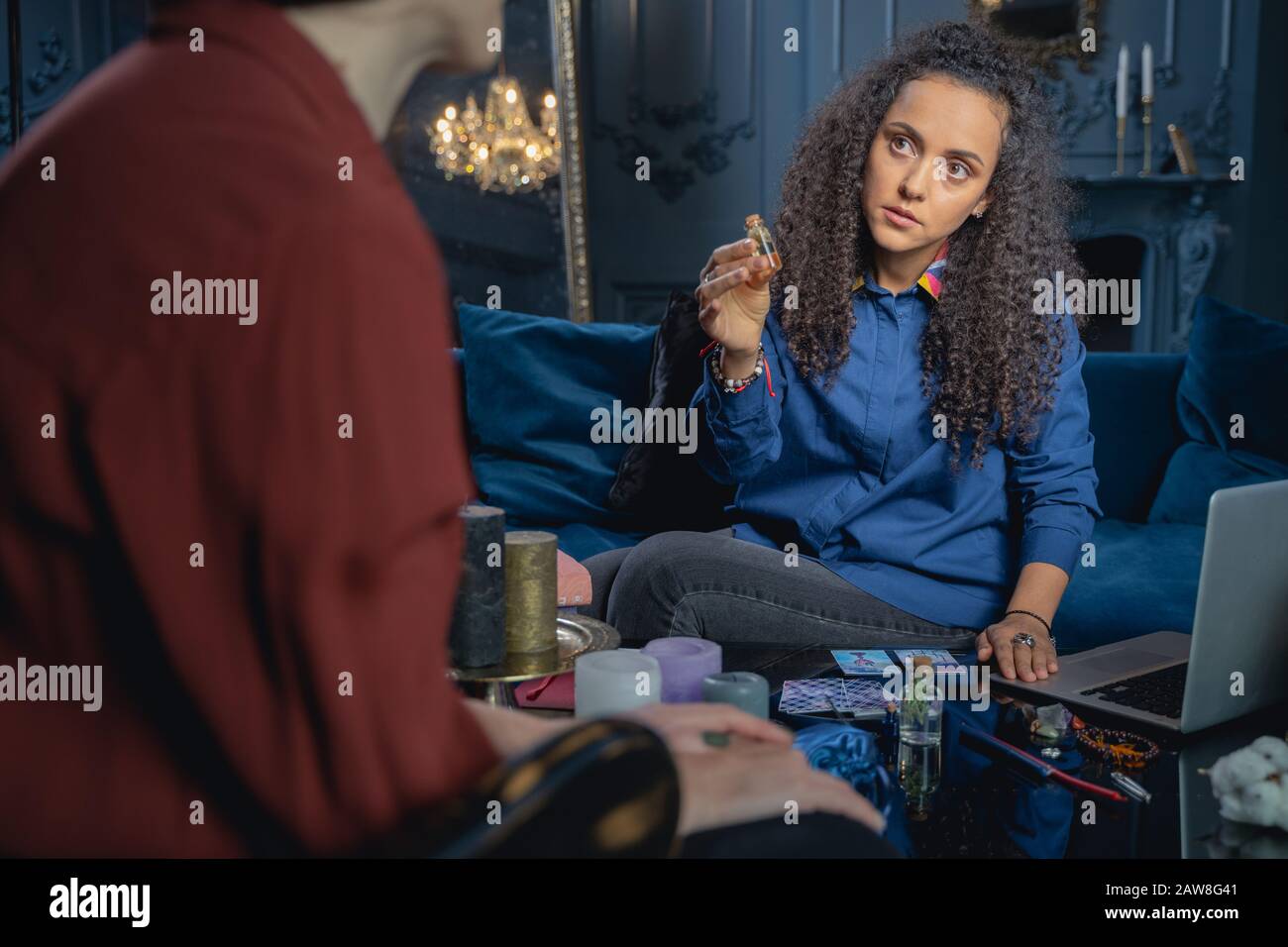 Girl holding a vial of healing potion Stock Photo - Alamy