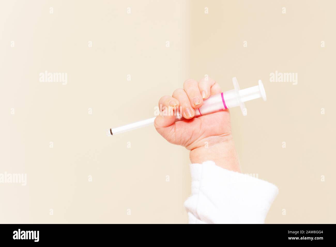 Little baby infant boy hold with small hand medical syringe ...