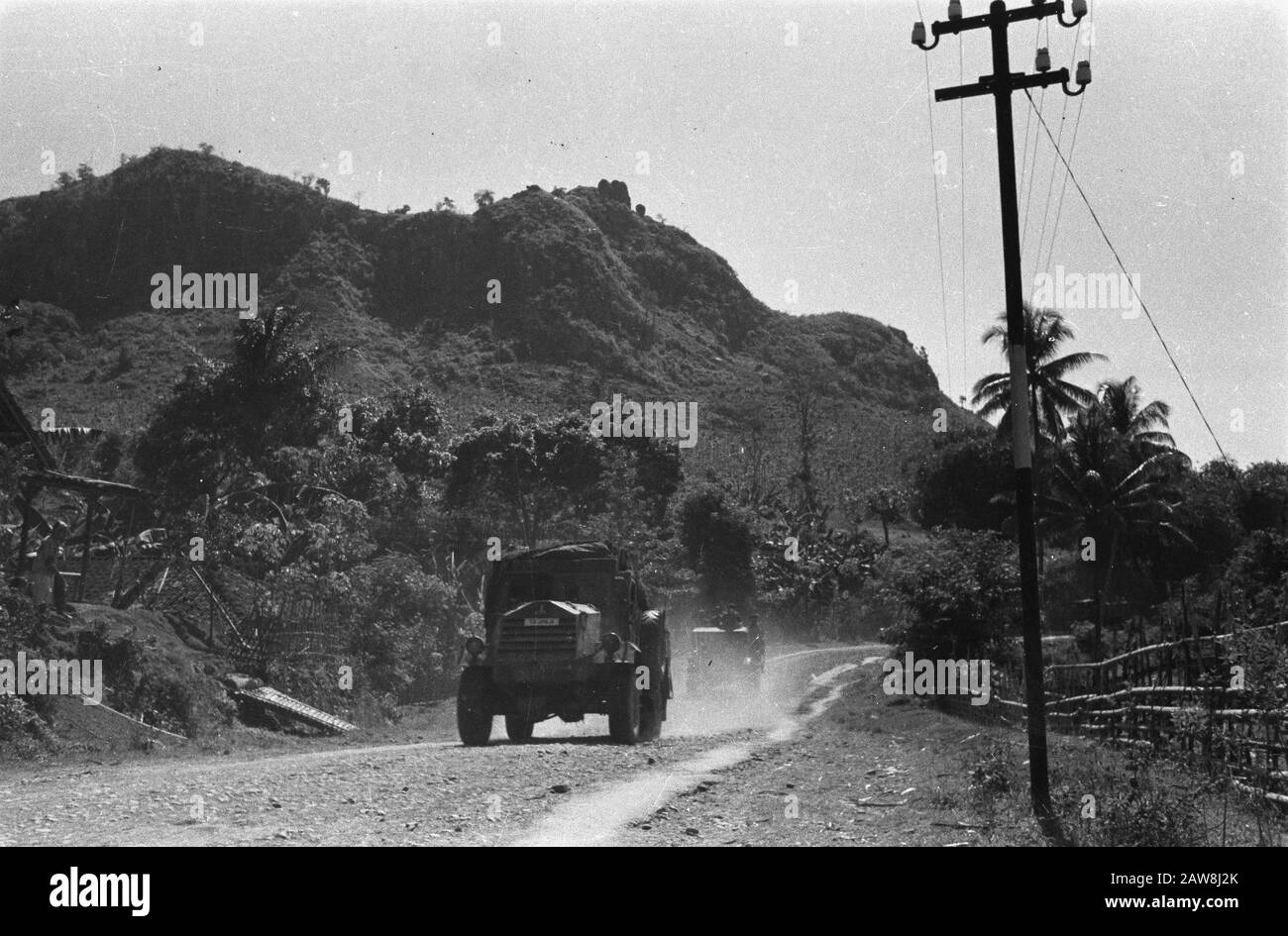 Poerwakarta Armored Car and truck on the road Date: July 25, 1947 ...