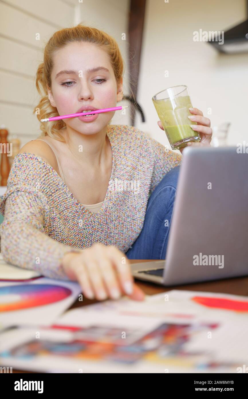 Concentrated young female person taking her sketches Stock Photo - Alamy Concentrated young female person taking her sketches Stock Photo - Alamy