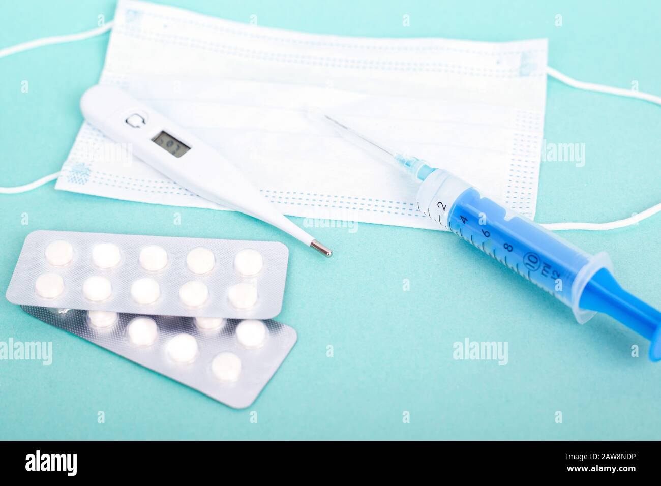 cold protection medical supplies on a blue background. mask respirator ...