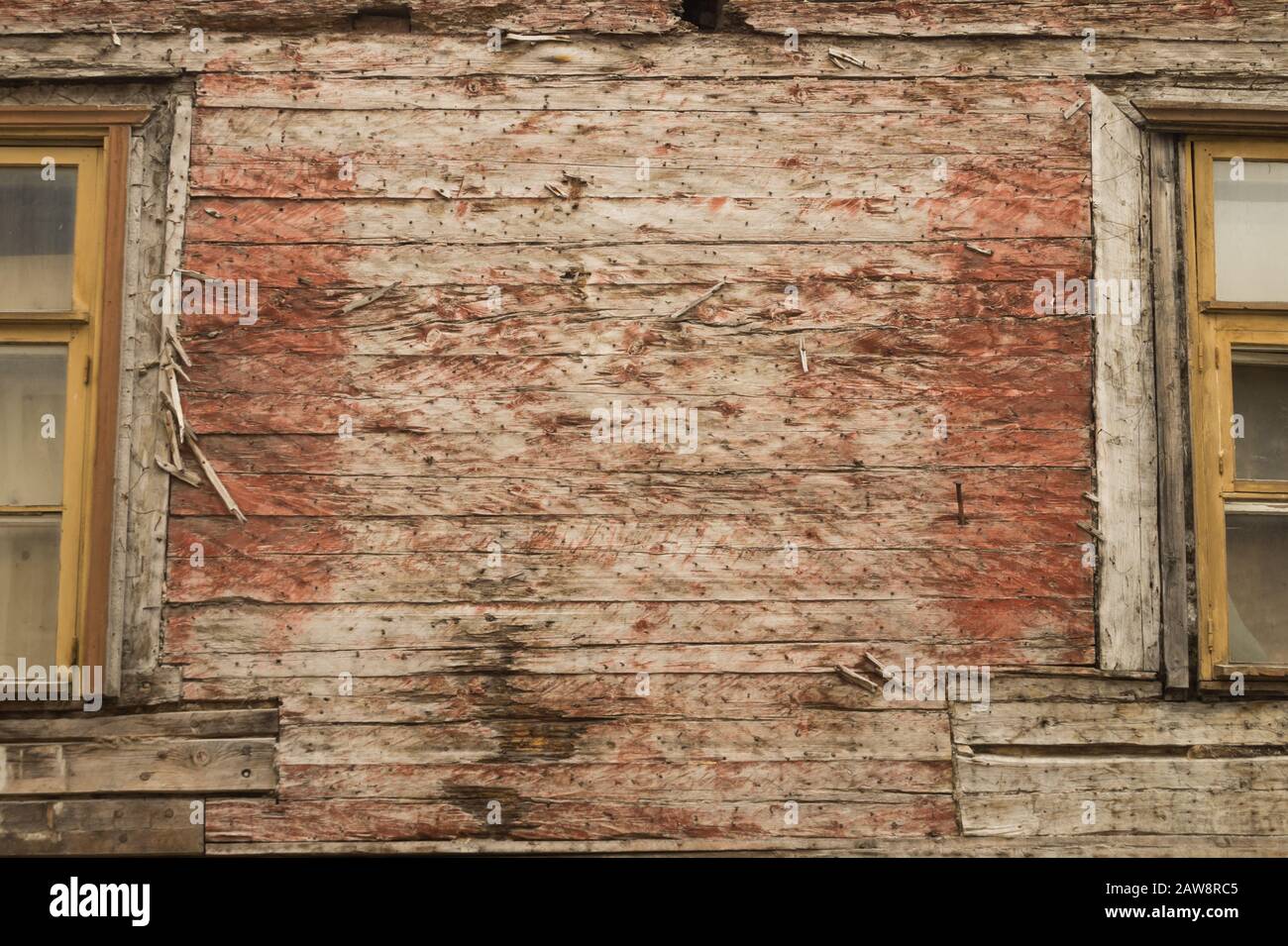 Windows of the old wooden house. wooden plank wall with windows ...