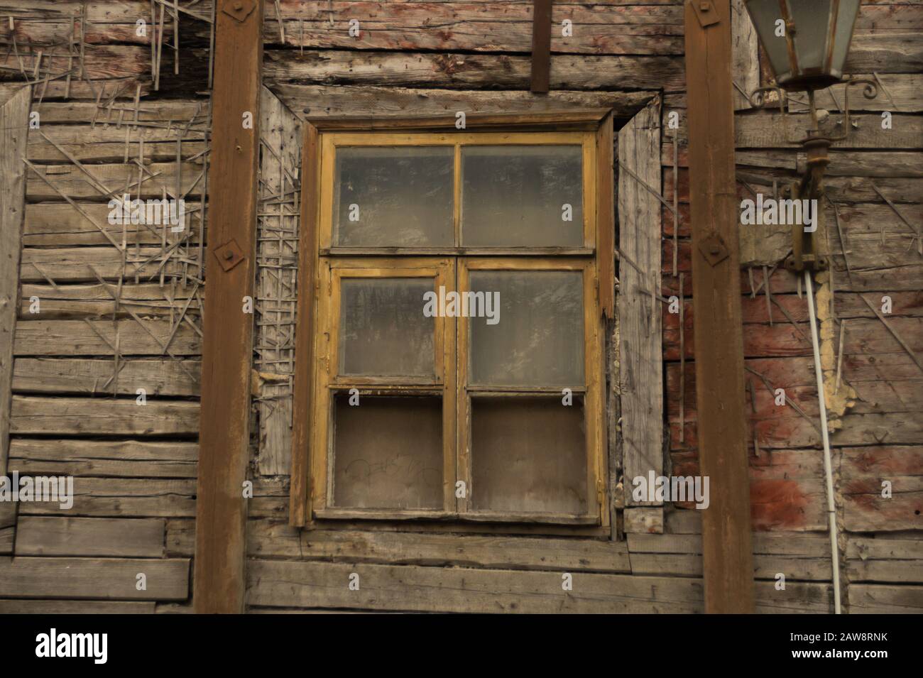 Windows of the old wooden house. wooden plank wall with windows ...
