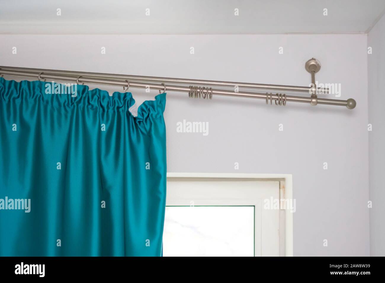 The cornice attached to the wall squinted down. The wall mount on which ...