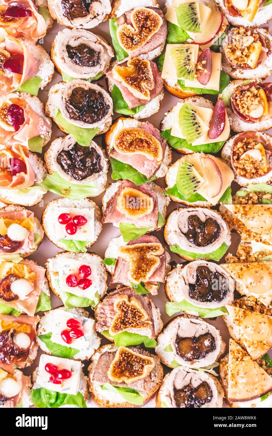 Flat lay of tasty canapes and appetizers catering service buffet meal ...