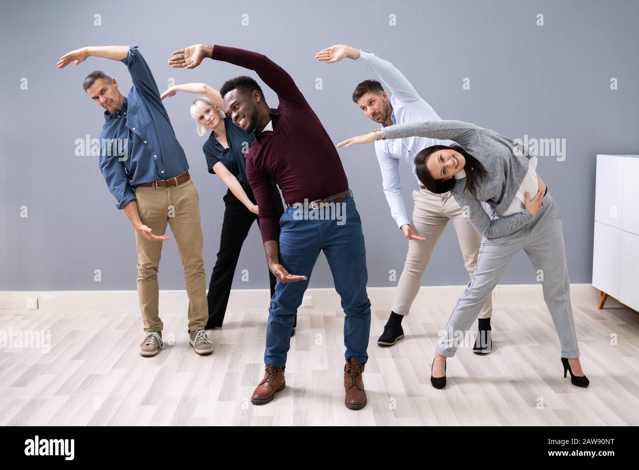 Diverse group people doing stretching hi-res stock photography and ...