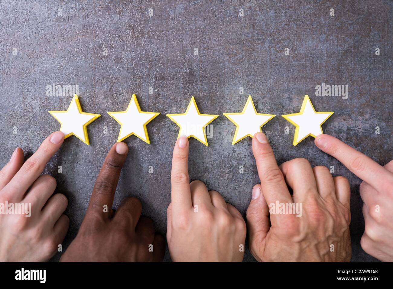 Person Hands Aligning Five Star Rating Icons. High Angle View Stock ...