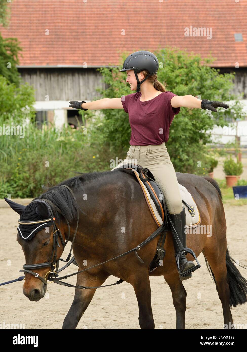 Lunge riding lesson, girl on German pony Stock Photo - Alamy