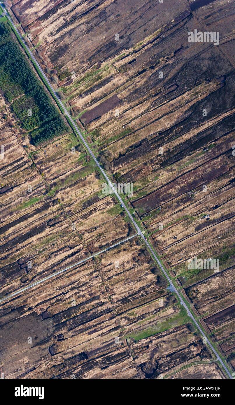 aerial view of country road through peat bog landscape in rural Ireland ...