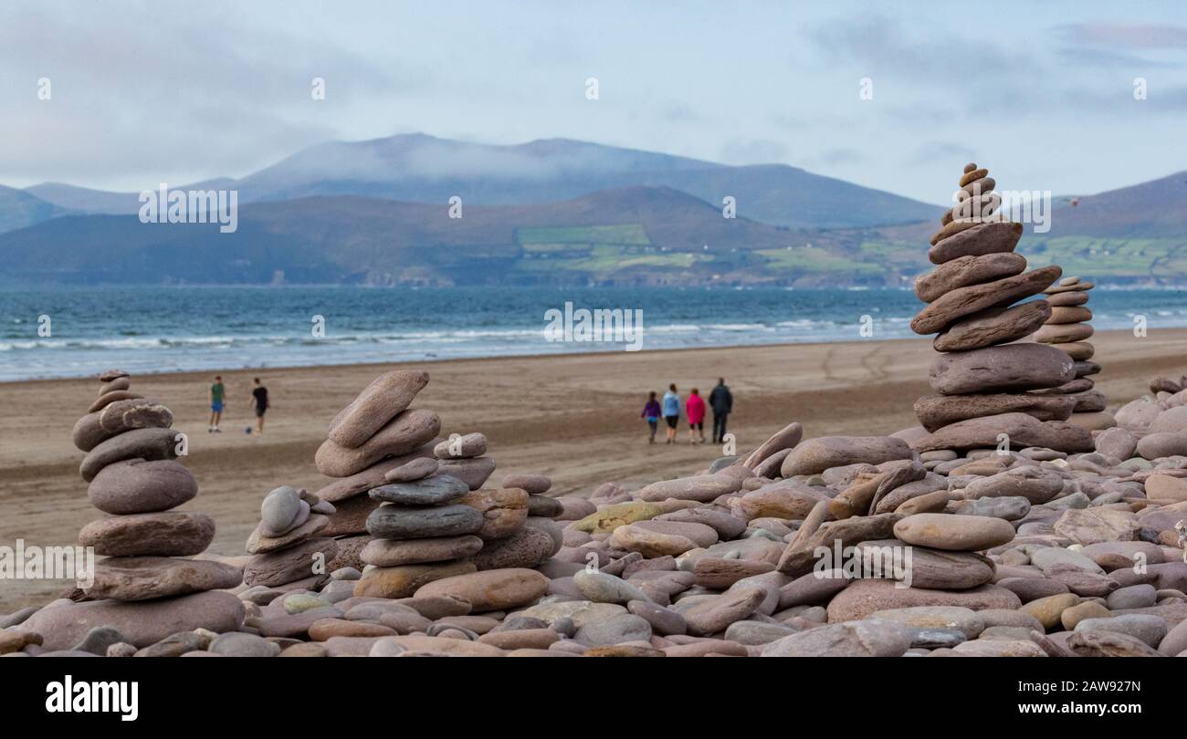 Zen rocks beach on the west coast of Ireland, Family walking on the ...