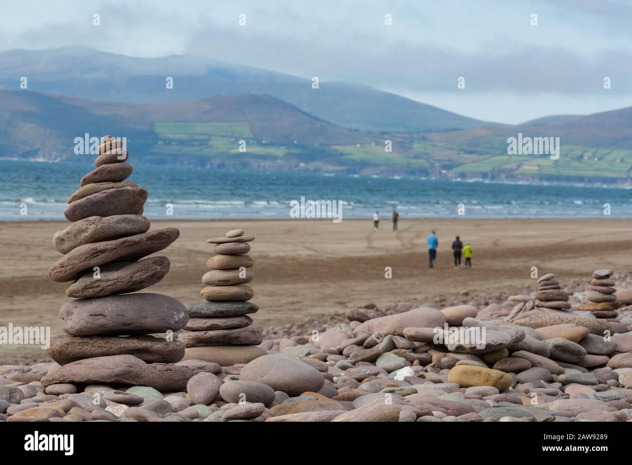 Zen rocks beach on the west coast of Ireland, Family walking on the ...
