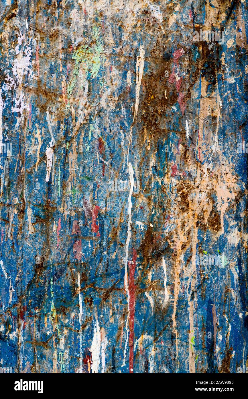 Grungy layred paint stained dripping blue metal background texture ...