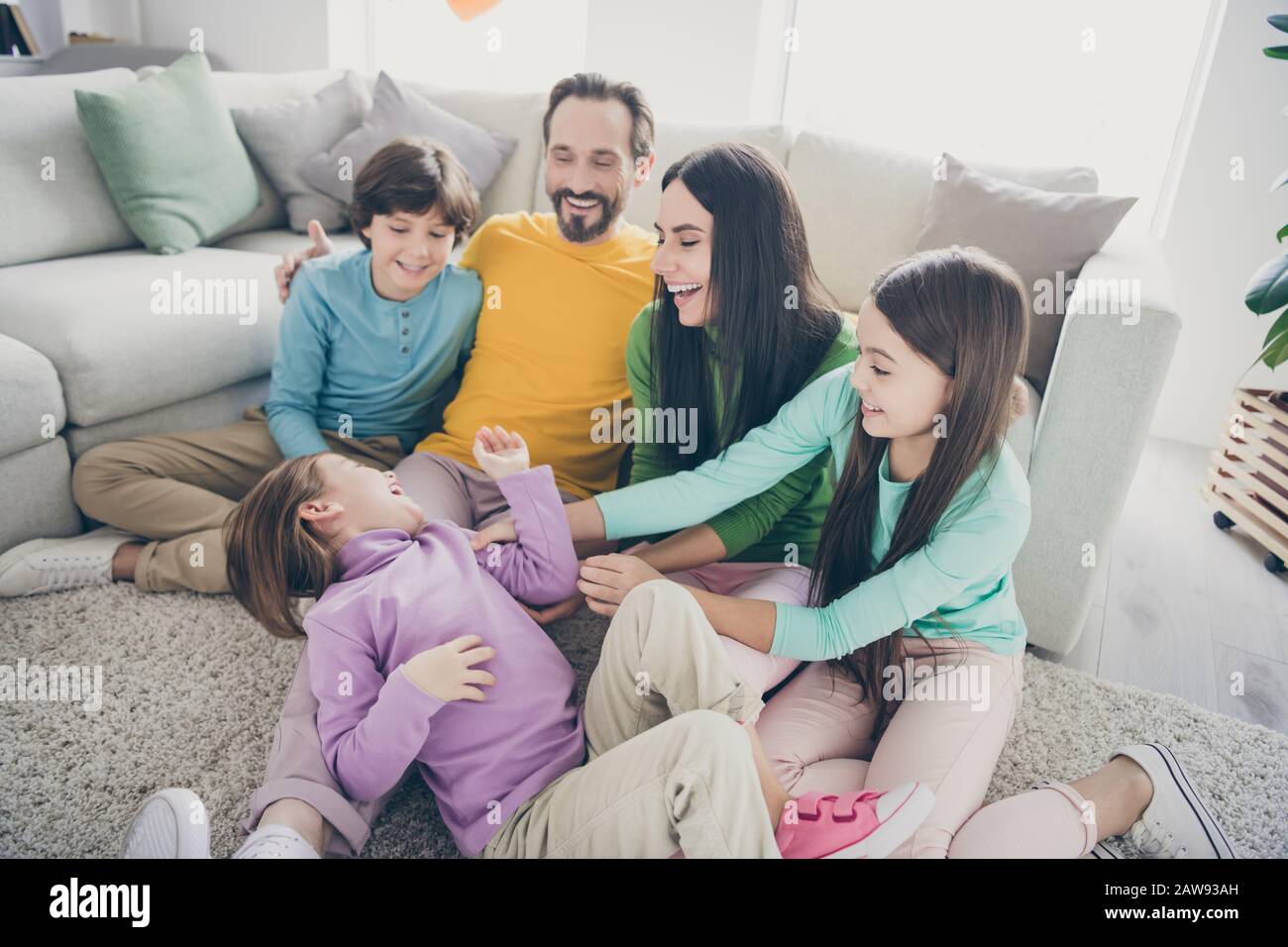 Nice attractive lovely cheerful cheery family three pre-teen kids ...