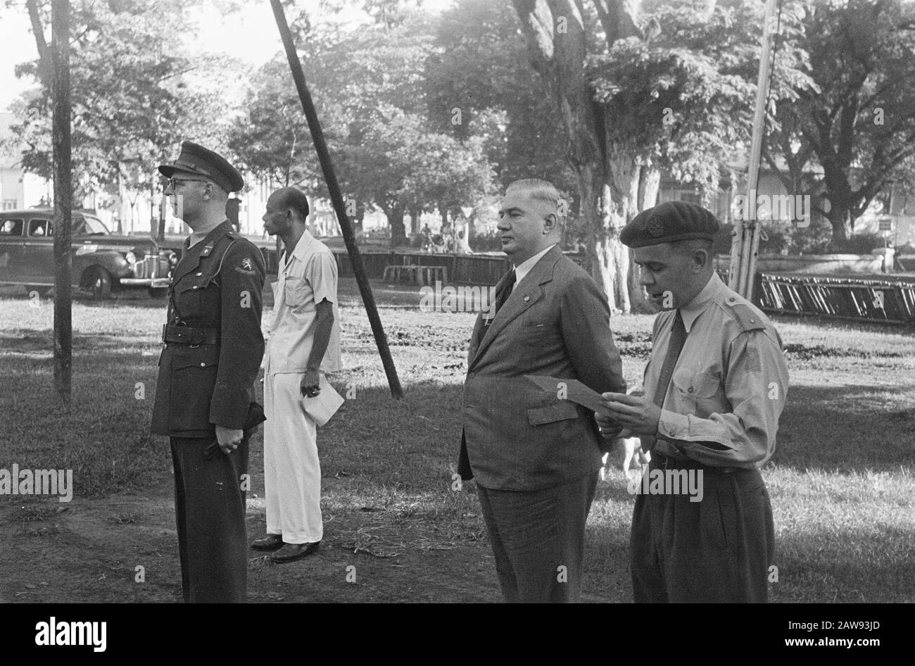 Ceremony (foreign grant award?). An aide reads a text. In the middle a ...