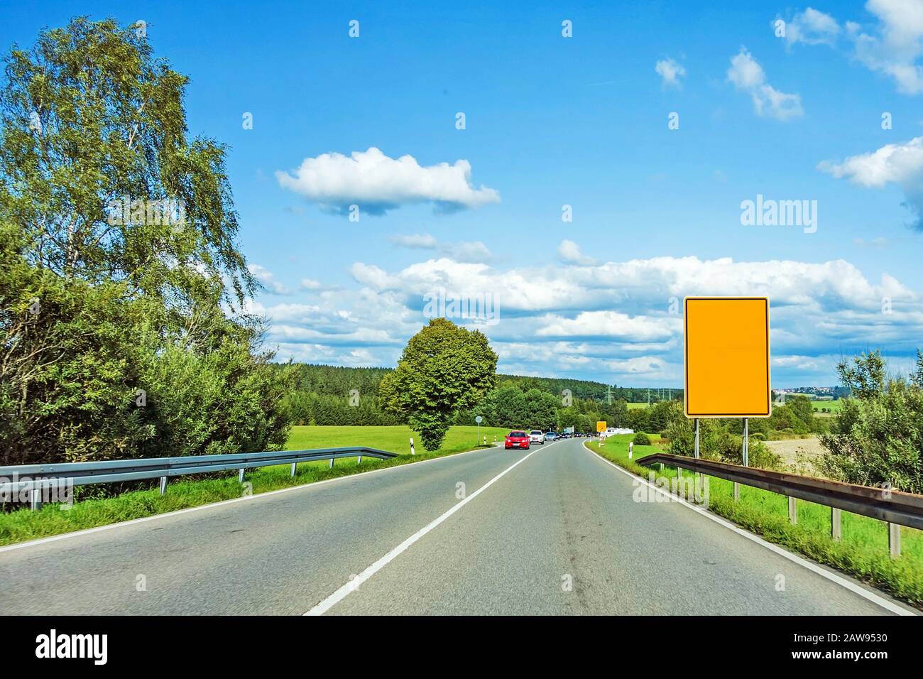 federal highway (germany) with empty yellow road sign - rural landscape ...