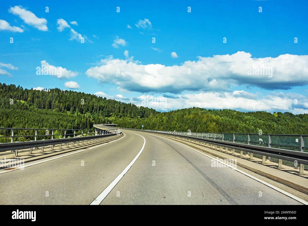 Road over valley - bridge in black forest - blue sky with clouds Stock ...