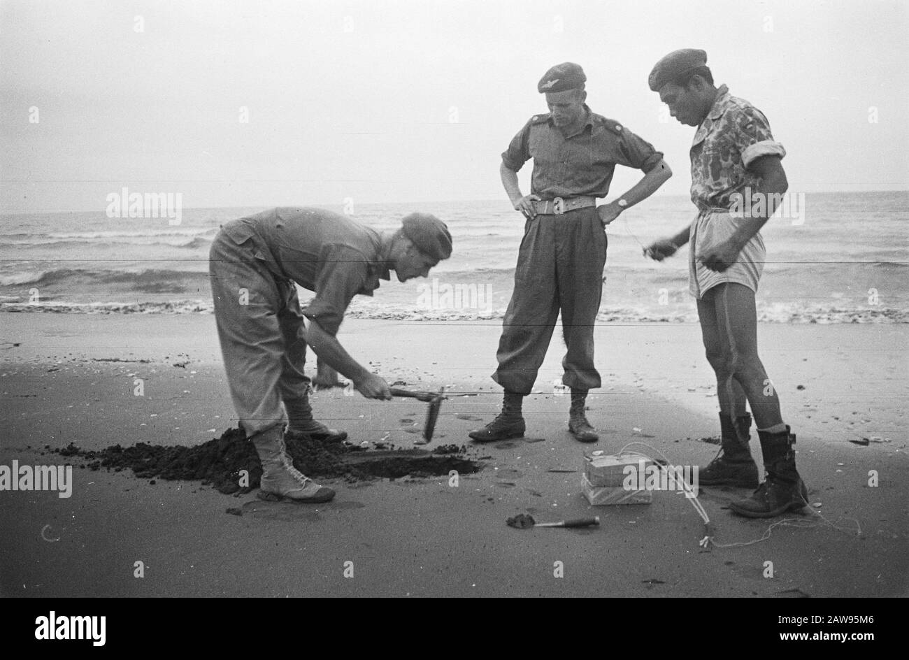 [Exercise amphibious landing operations] [Three soldiers on a beach. A ...