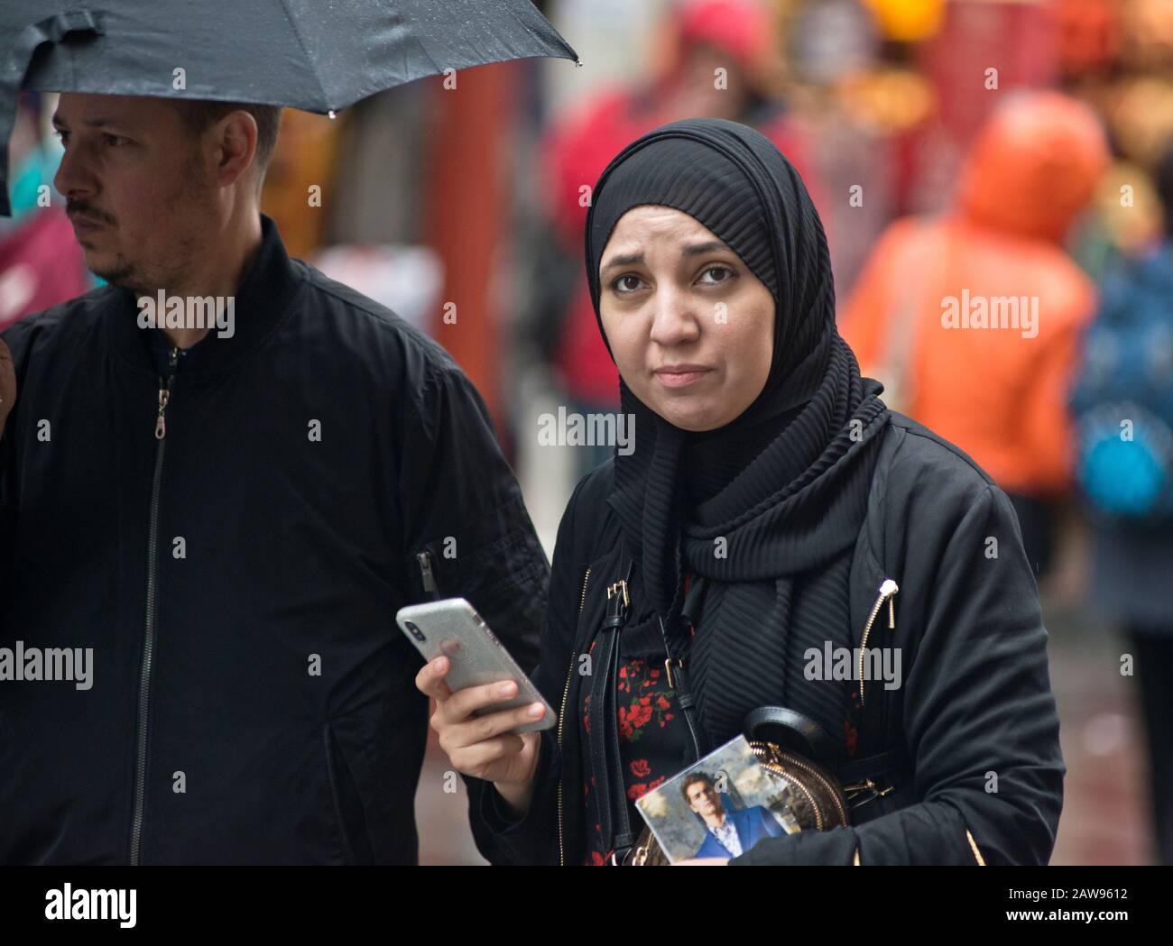 Muslim woman umbrella hi-res stock photography and images - Alamy