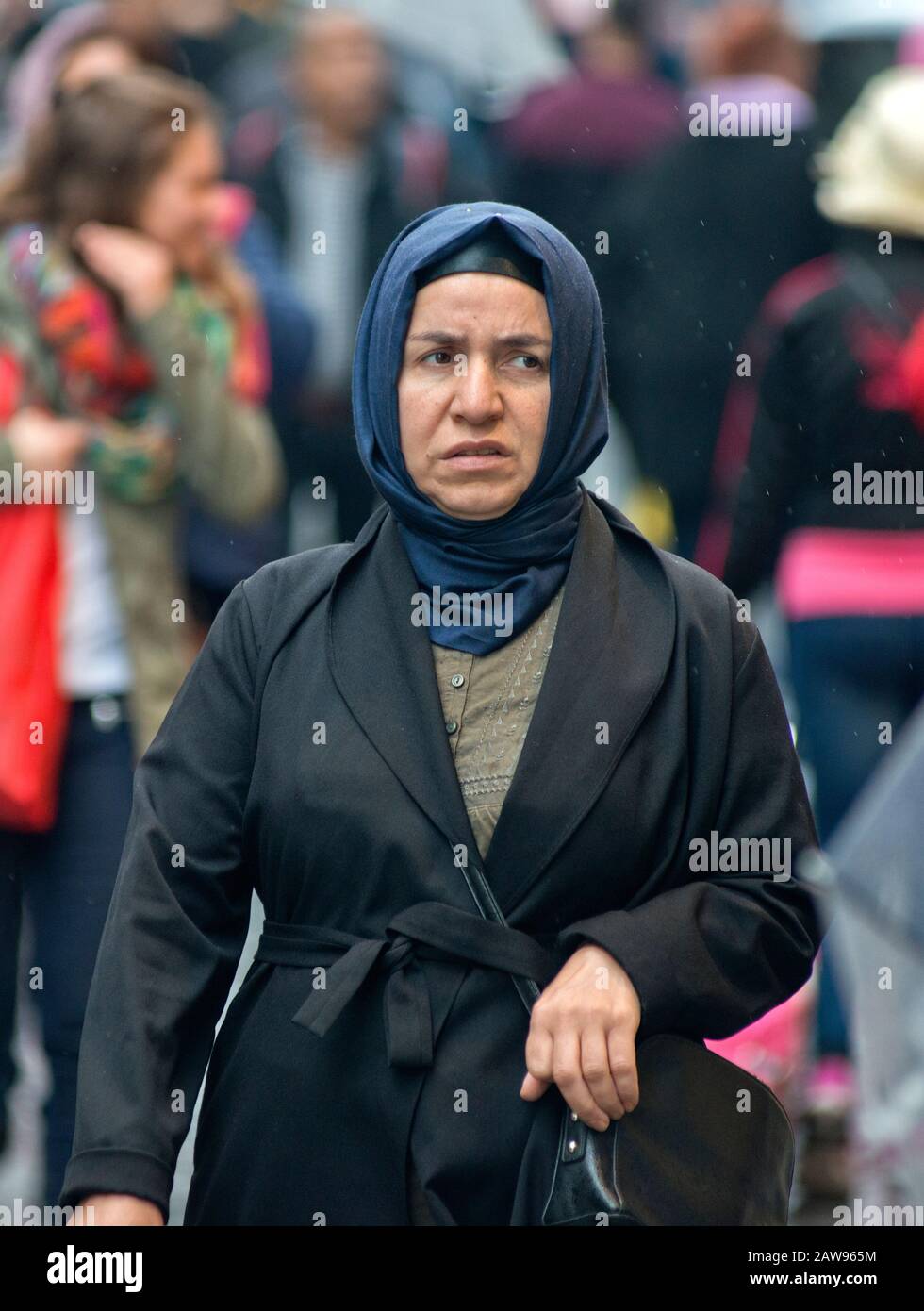 Istanbul: a muslim woman walking on Istiklal avenue. Turkey Stock Photo ...