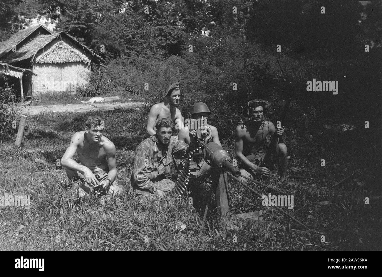 Soldiers posing with a piece of antiaircraft artillery and ground ...