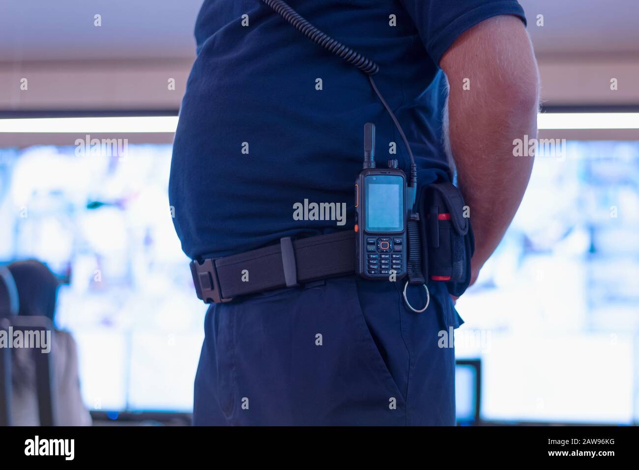 Security guard monitoring modern CCTV cameras in surveillance room ...
