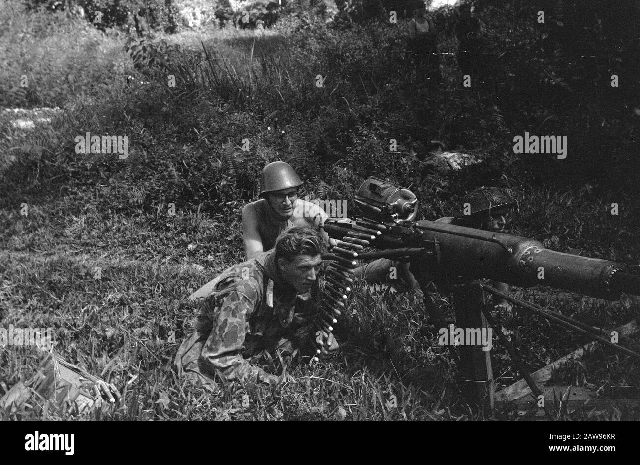 Soldiers posing with a piece of antiaircraft artillery and ground ...