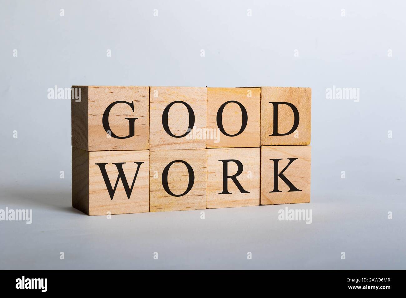 Wooden cubes with lettering spelling Good Work. Business concept Stock ...