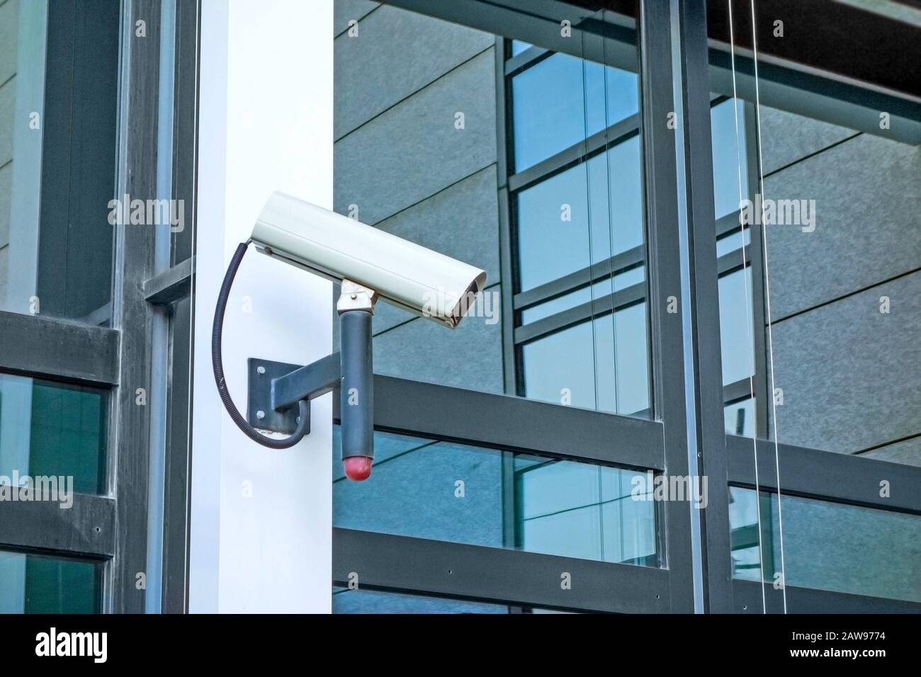 Security camera at modern building facade Stock Photo - Alamy