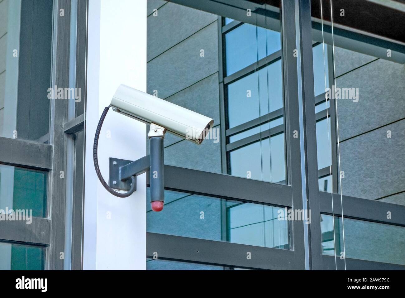 Security camera at modern building facade Stock Photo - Alamy