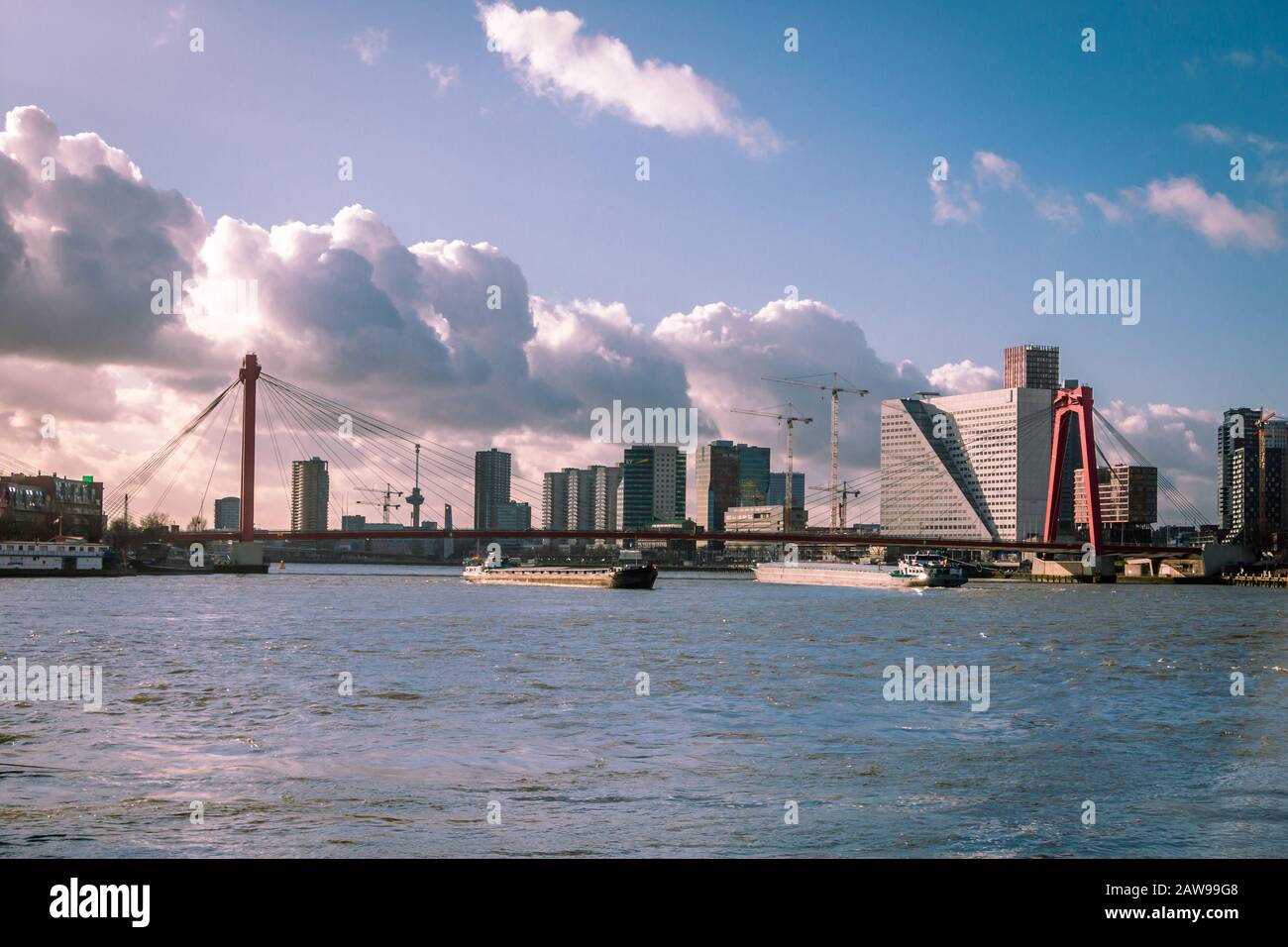 Cityscape in Rotterdam, beautiful clouds and sun in the sky, modern ...
