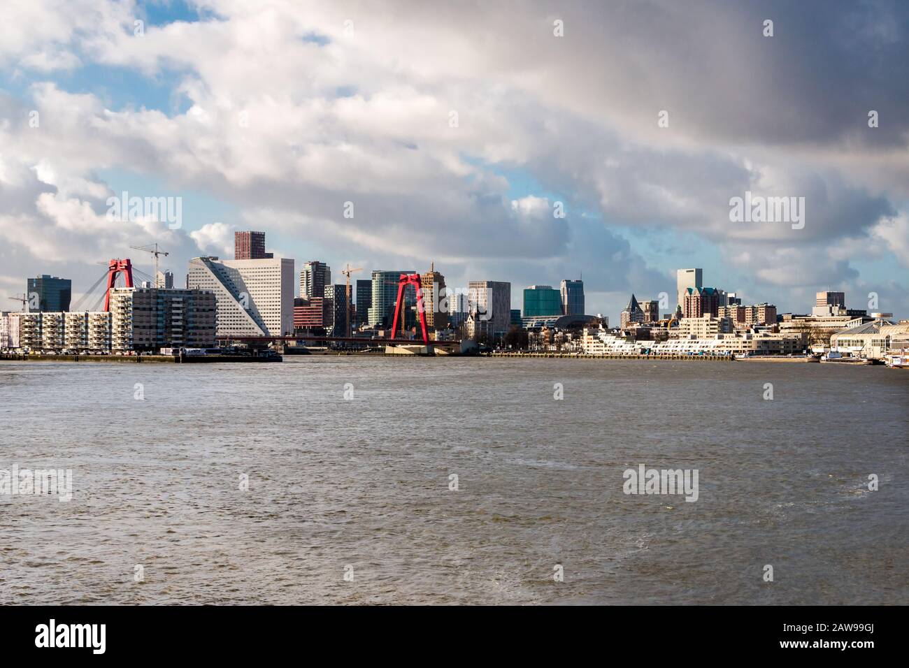 Cityscape in Rotterdam, beautiful clouds and sun in the sky, modern ...