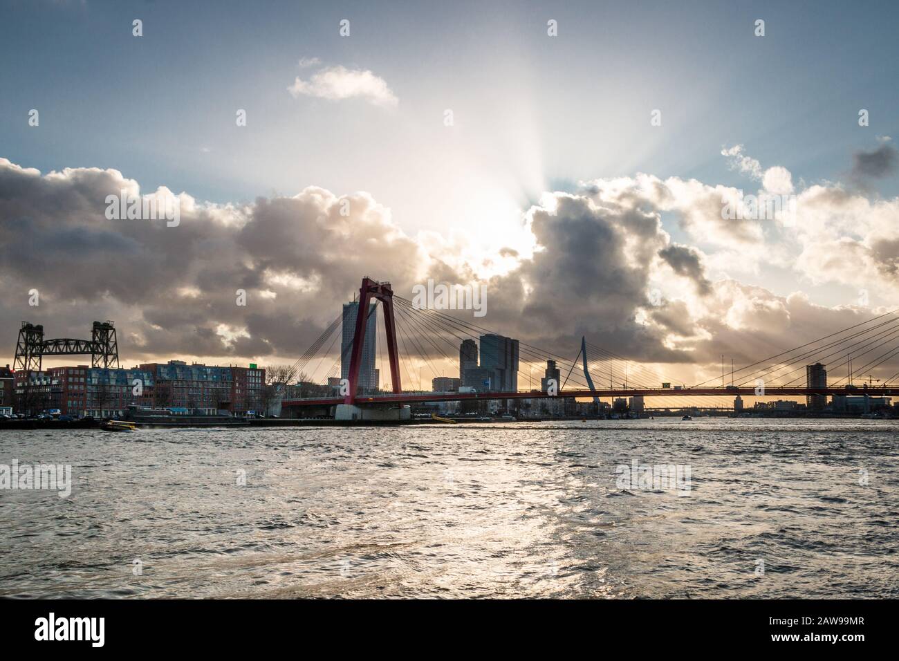 Cityscape in Rotterdam, beautiful clouds and sun in the sky, modern ...