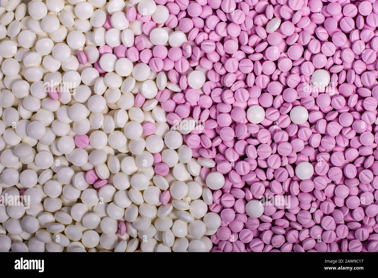 medicines background macro pink and white. Drugs, painkillers, colds ...