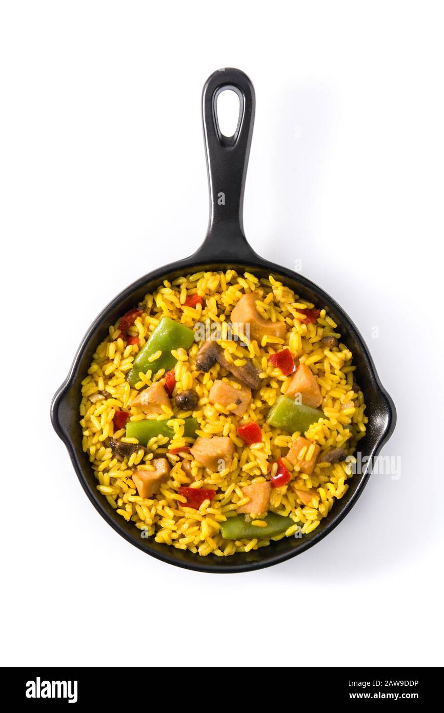 Fried rice with chicken and vegetables in frying pan isolated on white ...