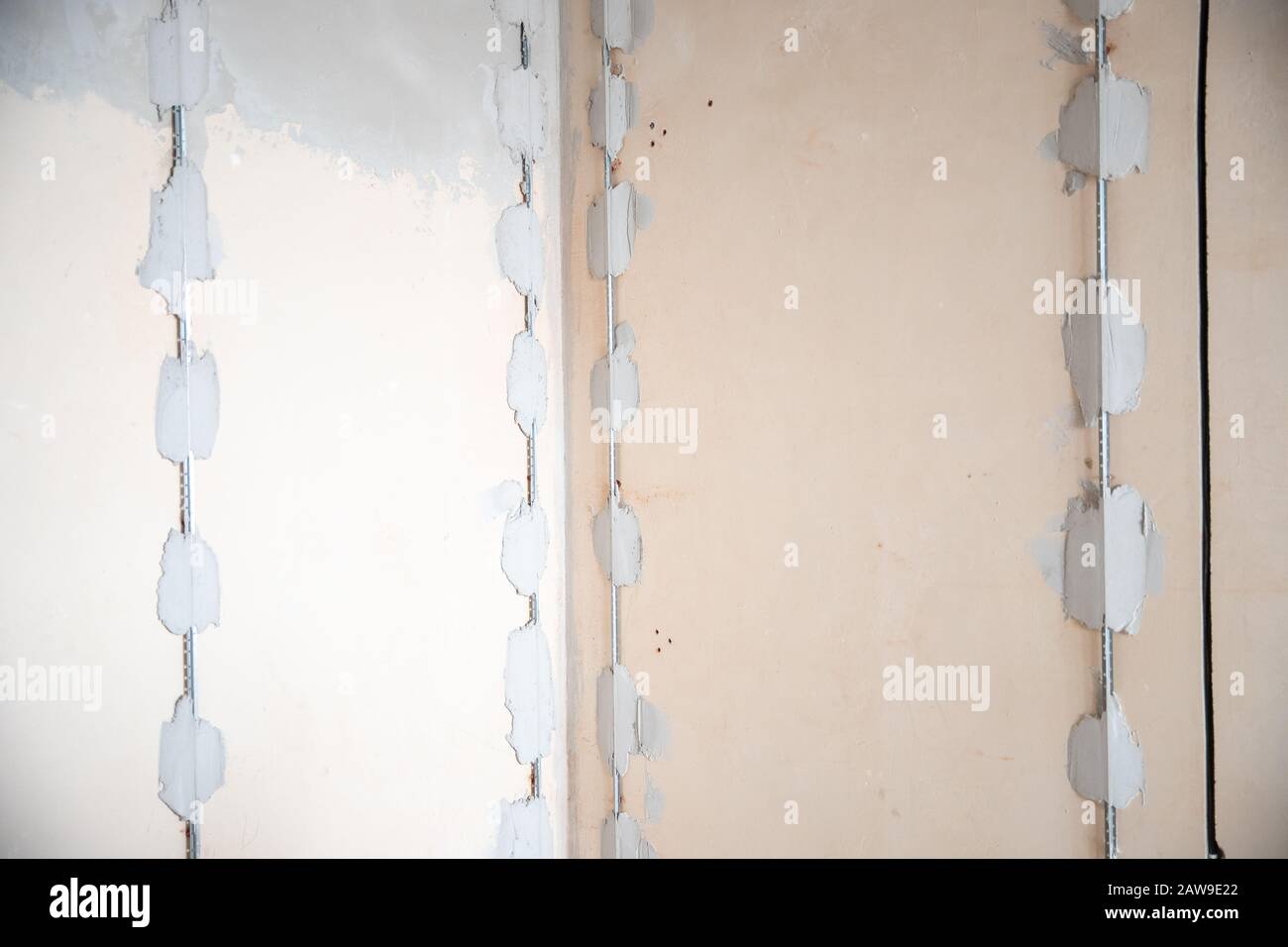 Level iron strip for leveling wall with stucco for repair Stock Photo ...